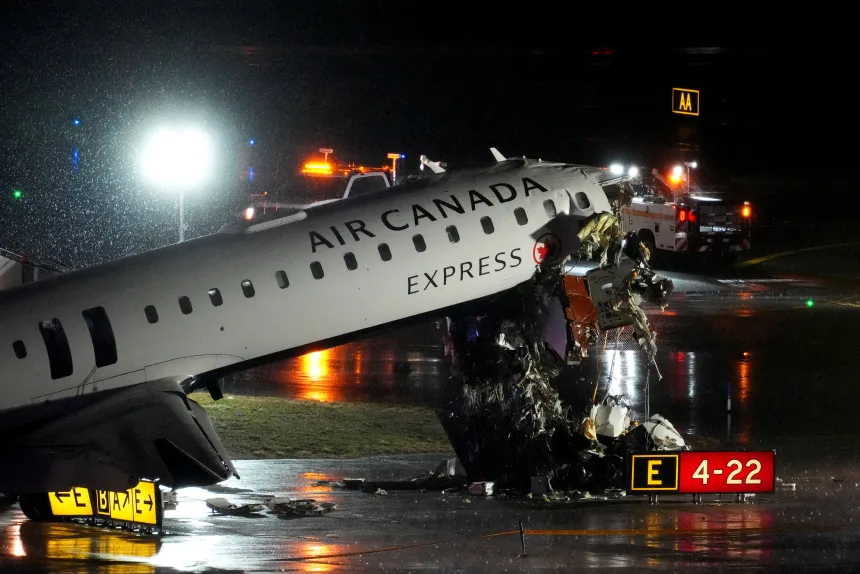 Air Canada attendant found strapped to seat outside jet after deadly crash